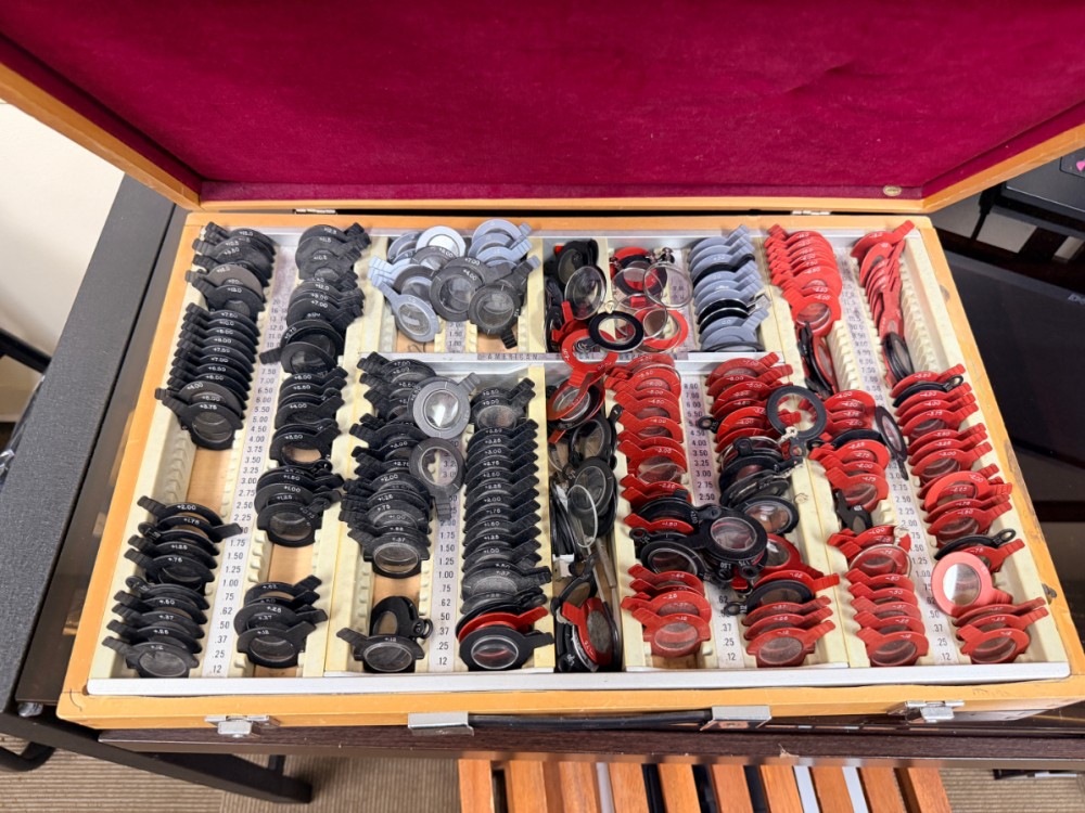 (2) PARTIAL OPTICAL TRIAL LENS SETS IN WOODEN STORAGE CASES. INCLUDES ...